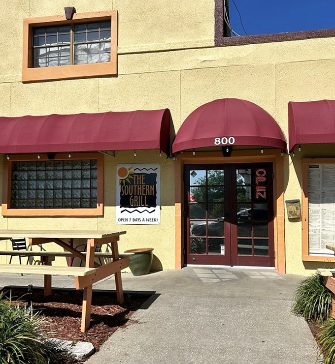 The entrance beckons with its simple "OPEN" sign and picnic table&mdash;a humble invitation to one of Jacksonville's most satisfying food experiences. No pretension, just promise. 