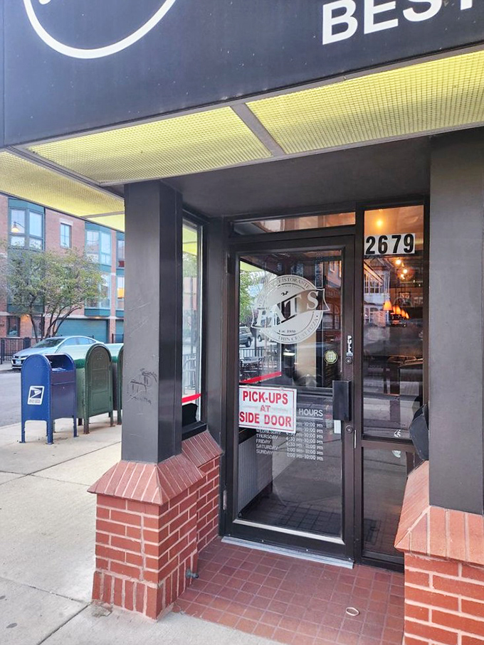 The entrance that separates the pizza tourists from the locals. That "Pick-ups at Side Door" sign speaks volumes about neighborhood loyalty.
