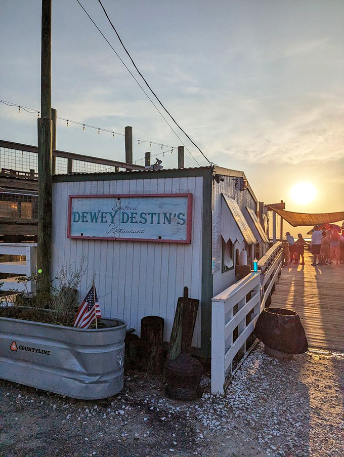 Golden hour at Dewey's &ndash; when the setting sun transforms a humble seafood shack into a postcard-perfect dining destination.