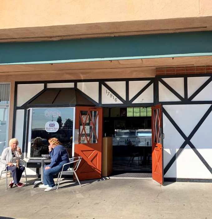 The entrance beckons like a portal to another culinary dimension. These doors have welcomed fish and chips enthusiasts for generations of crispy, golden goodness.