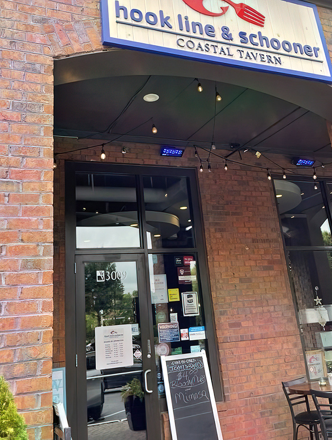 The entrance promises coastal escape&mdash;"COASTAL TAVERN" sign and string lights setting the stage for the maritime adventure waiting just beyond those doors.