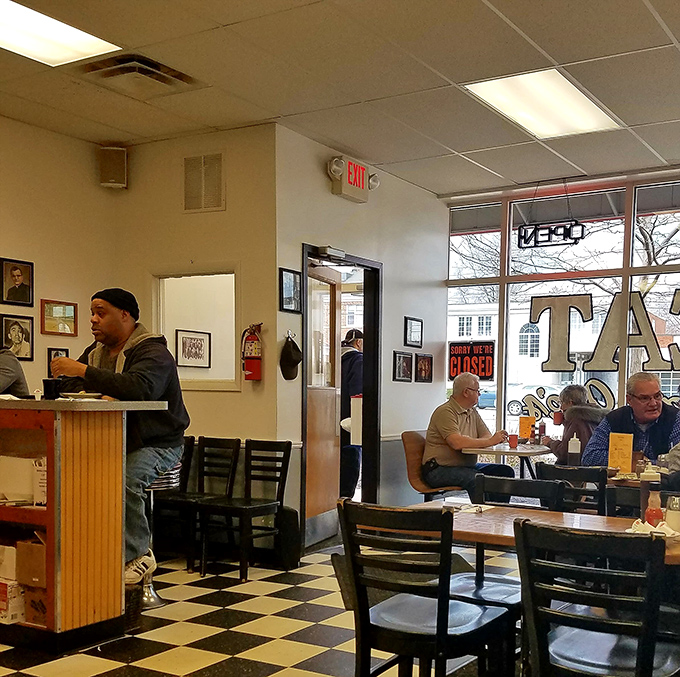 The dining room during service&mdash;where strangers become temporary neighbors united by the universal language of good food.