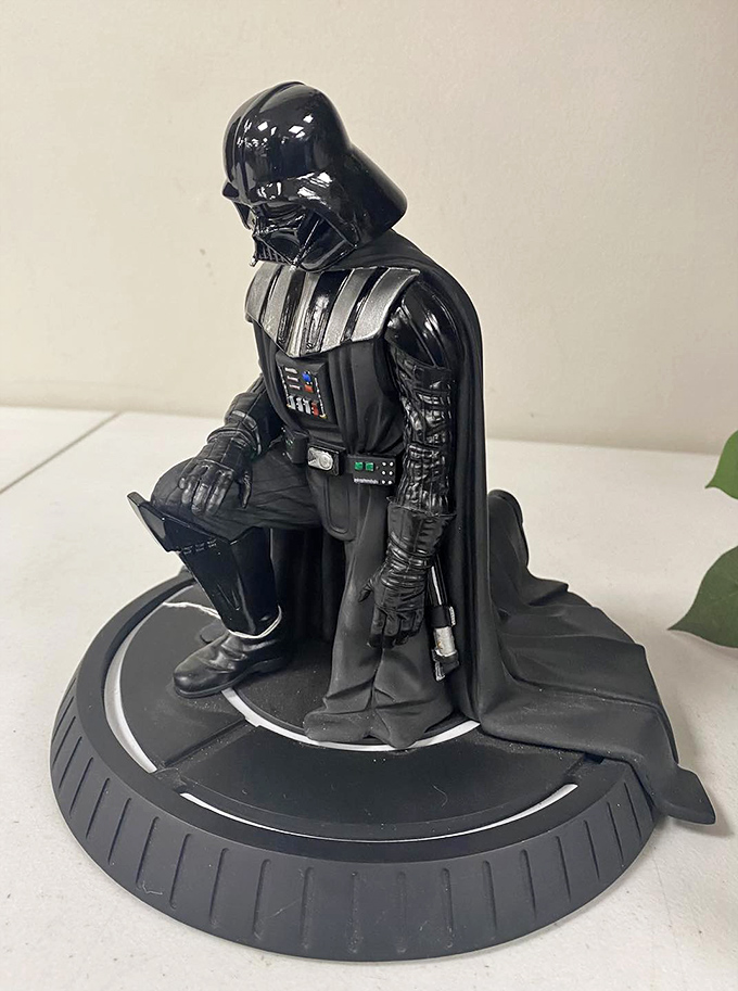 Darth Vader stands guard over the collectibles section, using the Force to convince you that yes, you absolutely need him in your life.