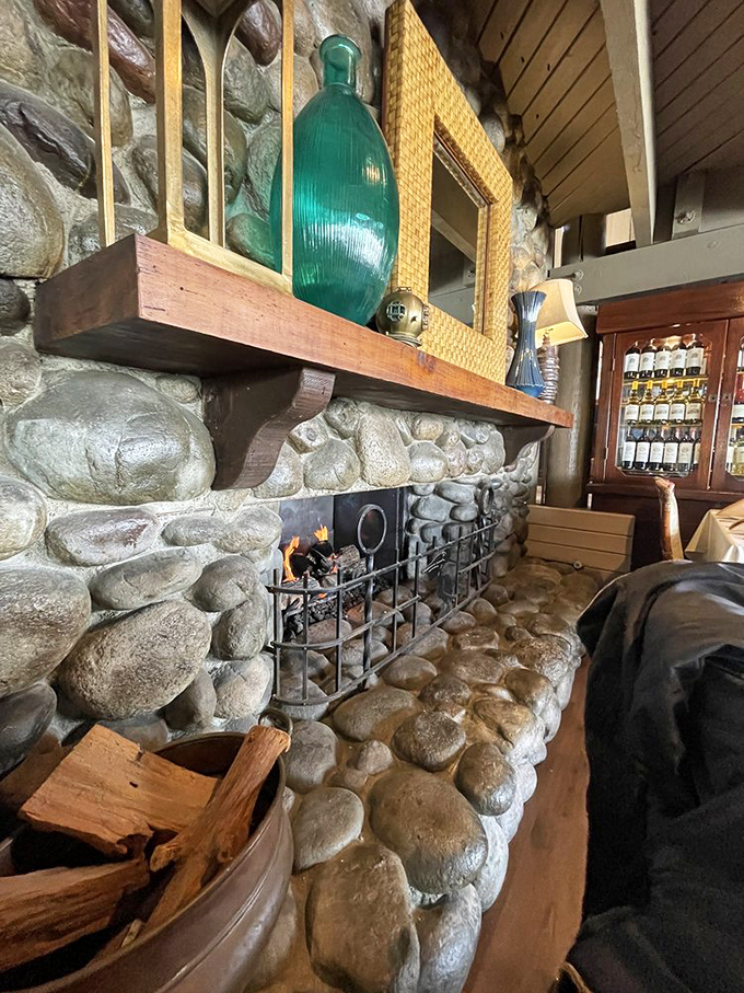 Stone fireplace that whispers "stay awhile" even as your waistband suggests otherwise. Cozy comfort meets coastal charm.