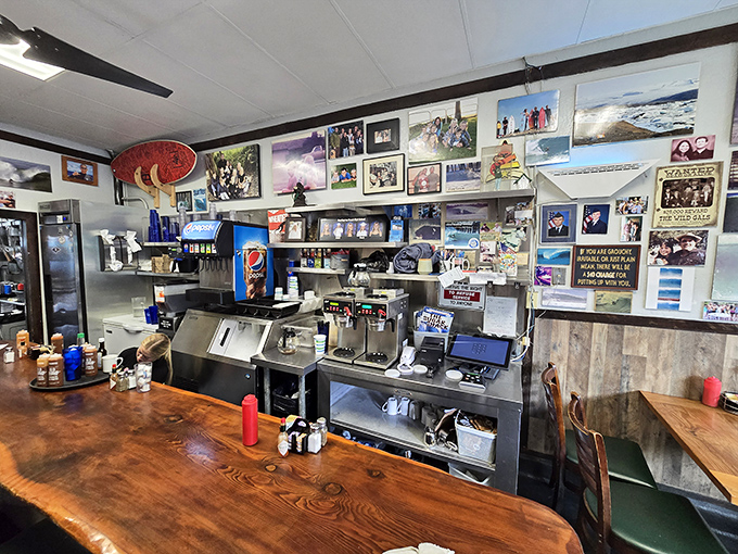 The counter where breakfast dreams come true. Every surface tells a story, from the worn wood to the walls plastered with decades of surf culture and community connections.