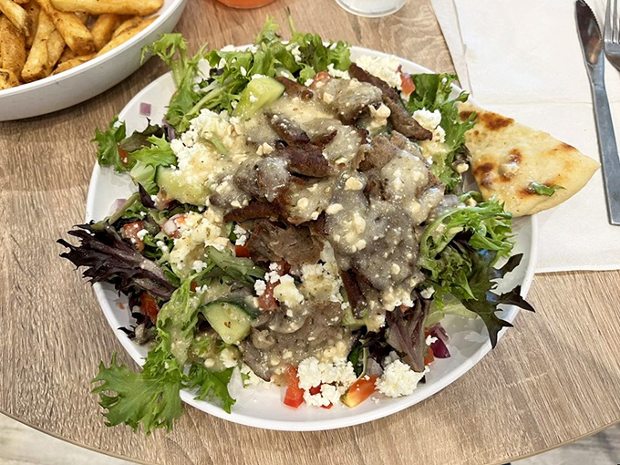 A Greek salad that transports you to the Mediterranean&mdash;crisp greens, feta, olives, and gyro meat creating a perfect harmony.