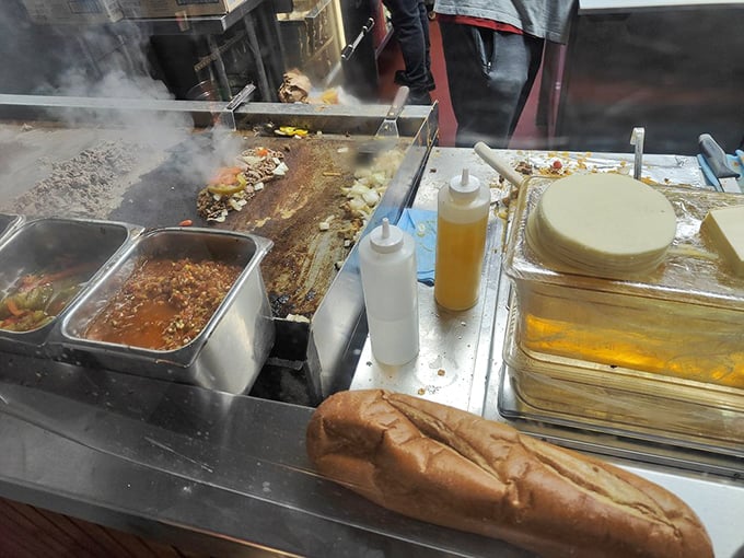 The battlefield where sandwich legends are born. That seasoned grill has more stories than a barber shop on Sunday.