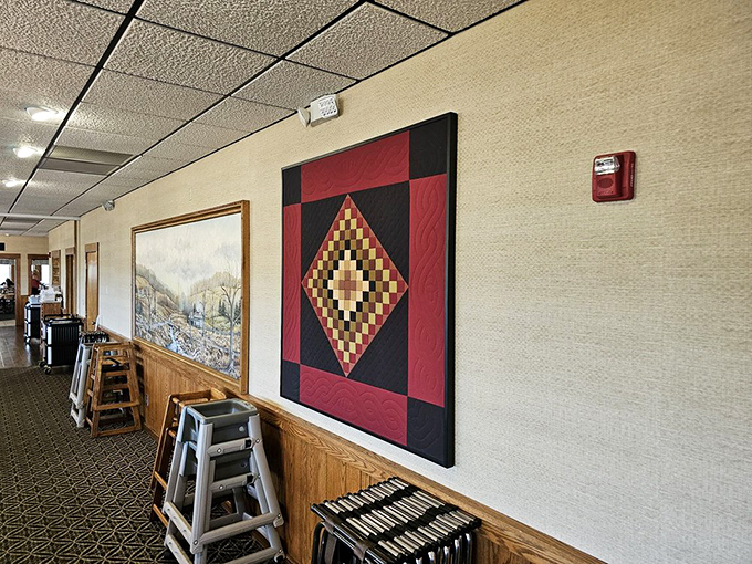 Amish quilts adorn the walls, adding splashes of geometric color. Not just decoration&mdash;they're textile time machines connecting diners to generations of craftsmanship.