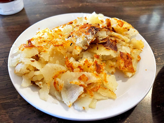 Hash browns with edges so crispy they could double as percussion instruments in a breakfast band.