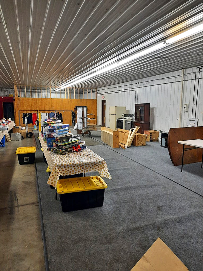 Vendor setup in progress&mdash;the calm before the bargain-hunting storm. Empty tables hold tomorrow's potential treasures.