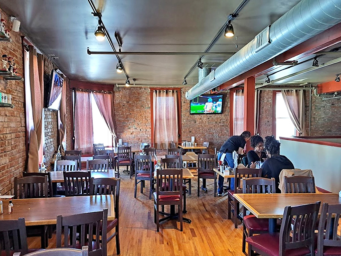 Exposed brick walls and wooden tables create the perfect stage for breakfast theater, where every plate gets its moment in the spotlight.