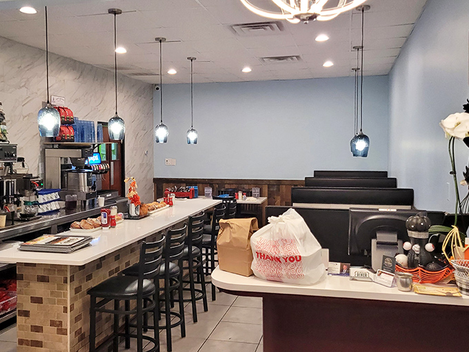 The counter seating area offers front-row tickets to the culinary show, where coffee flows and breakfast dreams come true.