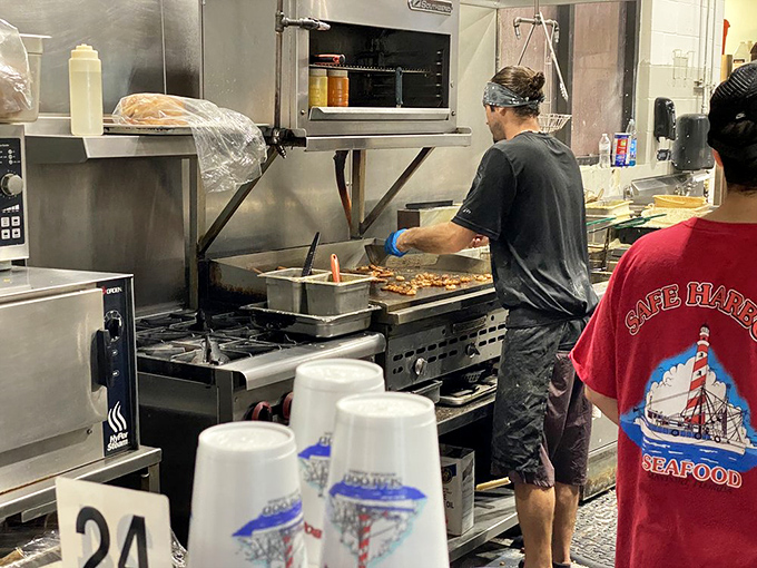 Behind-the-scenes magic where simple ingredients transform into coastal classics. The kitchen choreography that turns fresh catch into unforgettable meals.