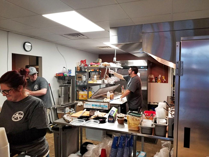 Behind the scenes where the magic happens&mdash;a kitchen choreography of smoke, meat, and dedication that transforms simple ingredients into edible art.