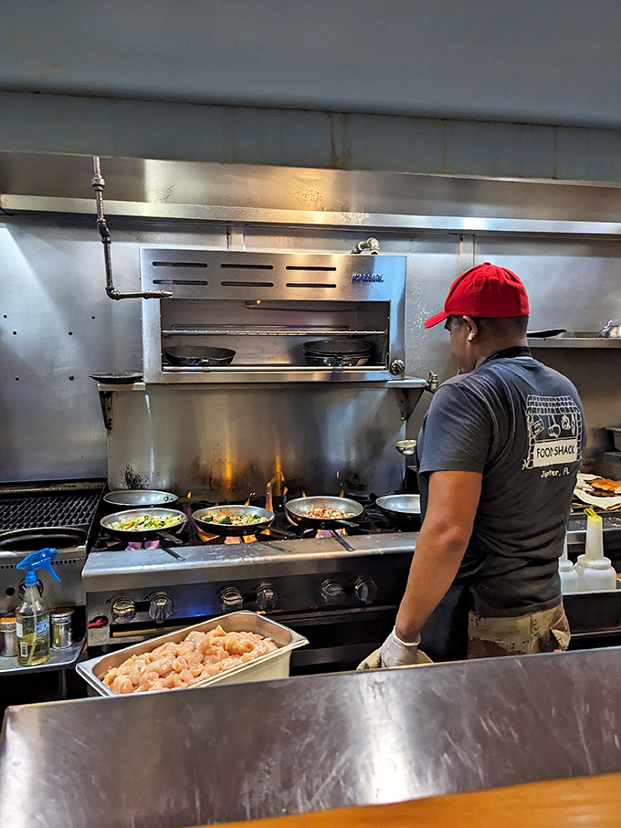 The open kitchen isn't just functional—it's dinner and a show, where culinary magic happens before your very eyes.