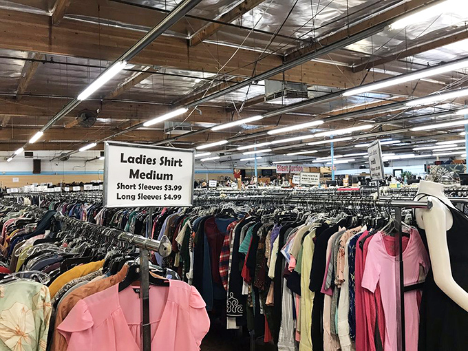 Fashion treasure hunting at its finest! These color-coded racks make finding that perfect vintage blouse or retro band t-shirt surprisingly efficient.