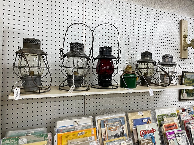 Railroad lanterns that once guided trains now guide decorators toward authentic vintage style. That red one probably prevented a few disasters in its working life.