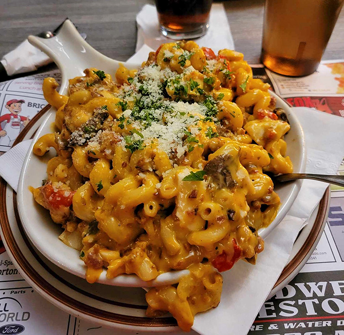 Mac and cheese elevated to an art form&mdash;creamy, cheesy, and topped with a sprinkle of parmesan. Comfort food that makes you feel simultaneously hugged and sophisticated.