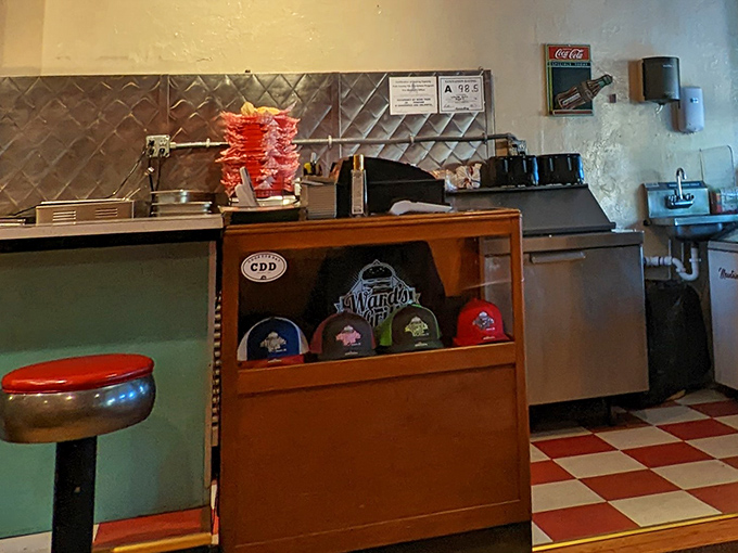 Even the merch corner speaks to small-town pride. Those caps aren't just souvenirs; they're membership cards to the Ward's Grill fan club.