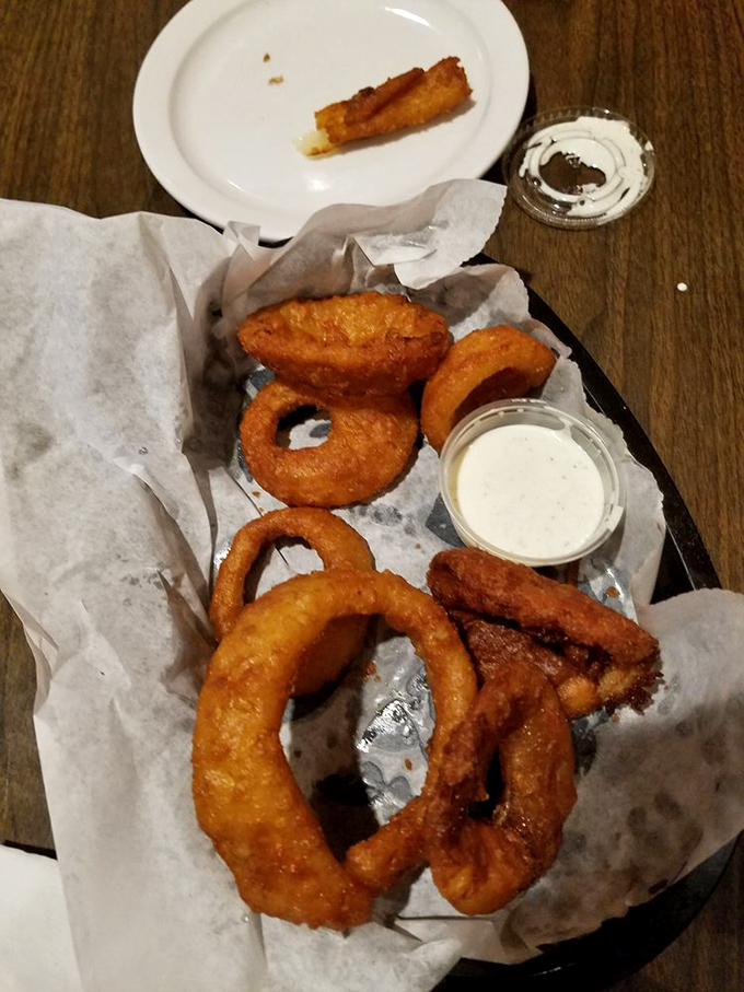 Onion rings that achieve the perfect balance&mdash;crispy, golden batter surrounding sweet onion that surrenders with each bite. Dipping sauce not optional.