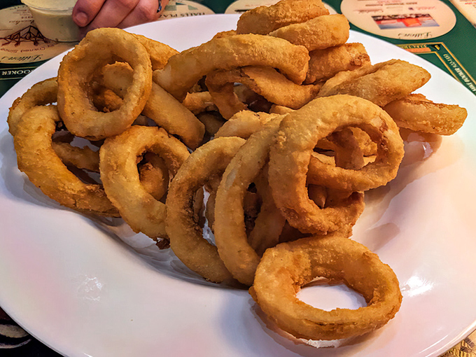 Onion rings so perfectly golden they could win beauty contests – crispy, sweet, and absolutely impossible to resist completely.