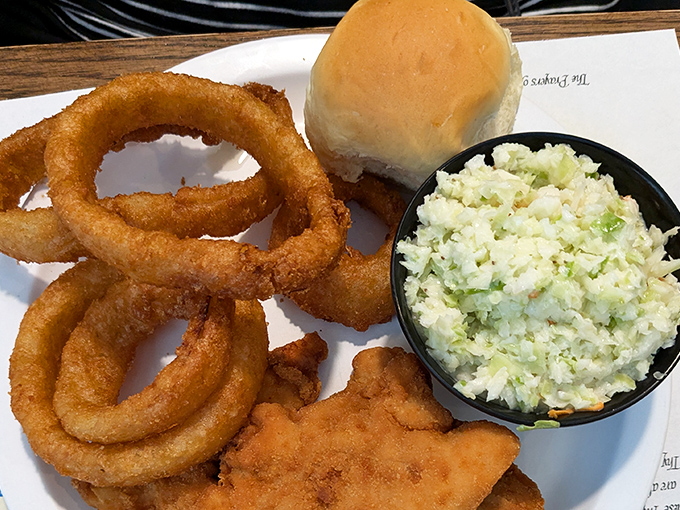 Onion rings with the perfect crunch-to-tenderness ratio, alongside coleslaw that didn't come from a plastic tub. This is how fast food should taste.