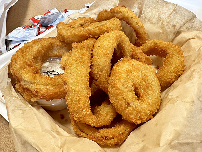 Onion rings with the golden ratio of crunch-to-tenderness. These aren't just sides&mdash;they're main attractions that happen to be circular.