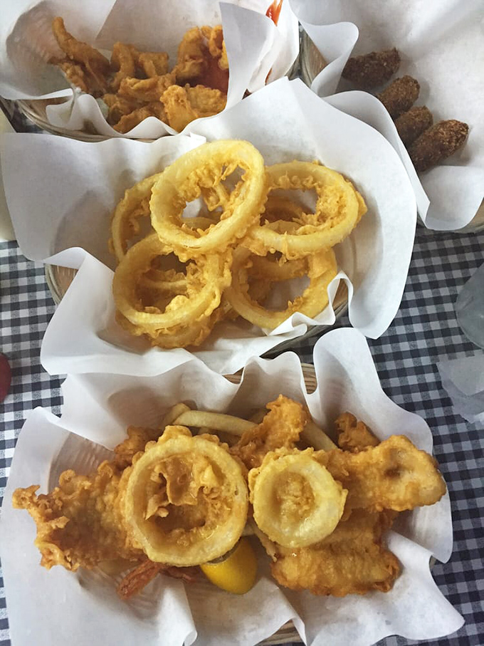 A seafood spread at its most honest&mdash;paper-lined baskets, simple sides, and the understanding that sometimes perfect food needs zero embellishment.