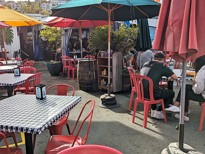 Colorful umbrellas and casual outdoor seating create that perfect "I'm not going back to the office" atmosphere that makes lunch feel like a mini-vacation.