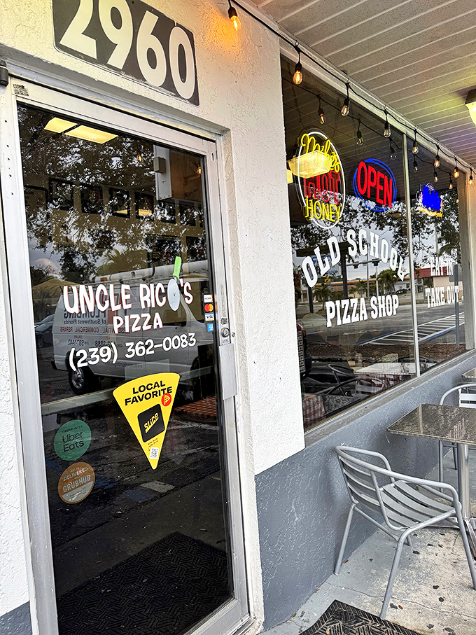 Even the outdoor seating whispers "stay awhile" with simple chairs that promise comfortable pizza contemplation sessions.