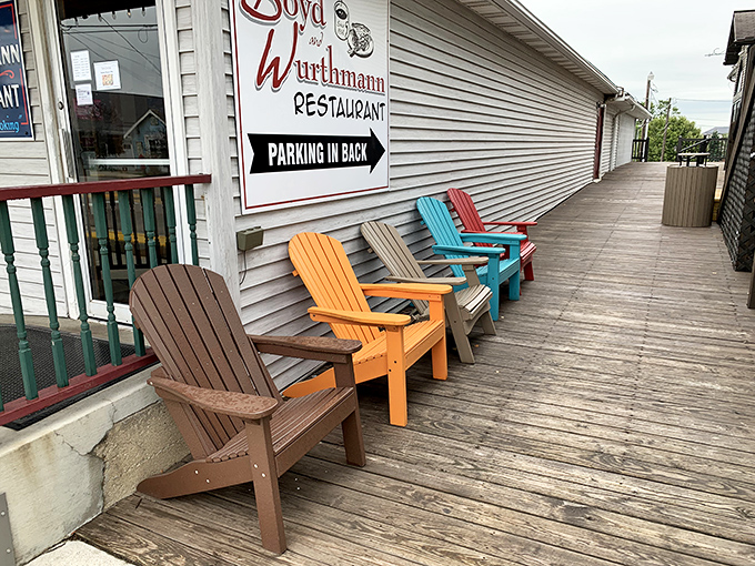 Adirondack chairs in cheerful colors invite you to digest both your meal and the simple pleasure of watching the world go by.