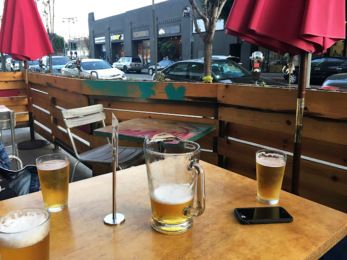 Outdoor dining with urban flair &ndash; where beer pitchers and sunshine create the perfect backdrop for Mediterranean-inspired feasting.