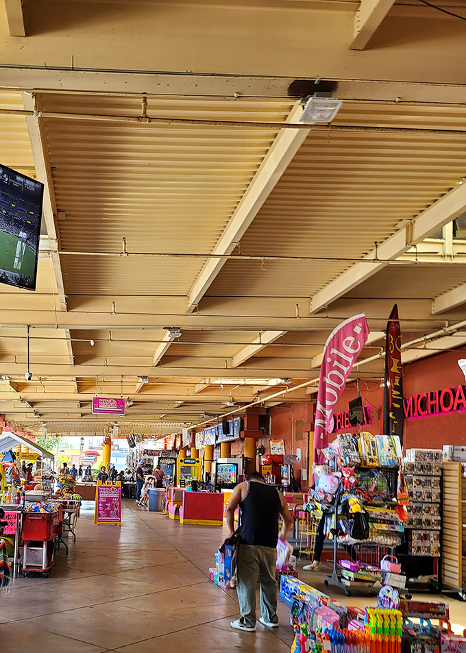 The indoor-outdoor experience creates a festival atmosphere year-round. Under these simple awnings, commerce and community have thrived for decades.