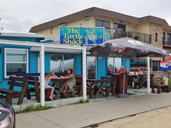 Outdoor seating where the ocean breeze serves as free air conditioning and the picnic tables say, "Get comfortable, stay awhile."