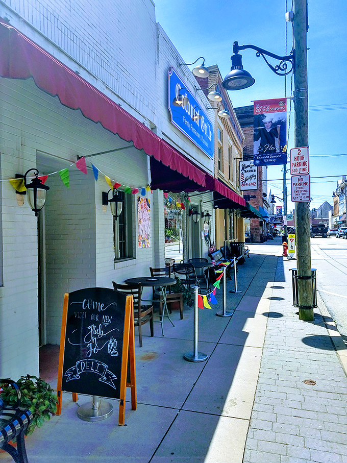 Sidewalk seating that invites you to people-watch while you feast &ndash; the chalkboard sign practically whispers "yes, you deserve that side of home fries."