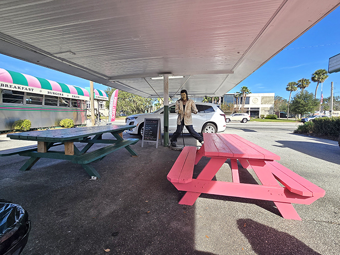 Outdoor picnic tables painted the color of flamingos&mdash;because in Florida, even your lunch seating should remind you you're in paradise.