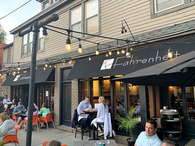 String lights create a magical canopy over Fahrenheit's outdoor seating area, where Cleveland evenings transform into something almost Mediterranean.