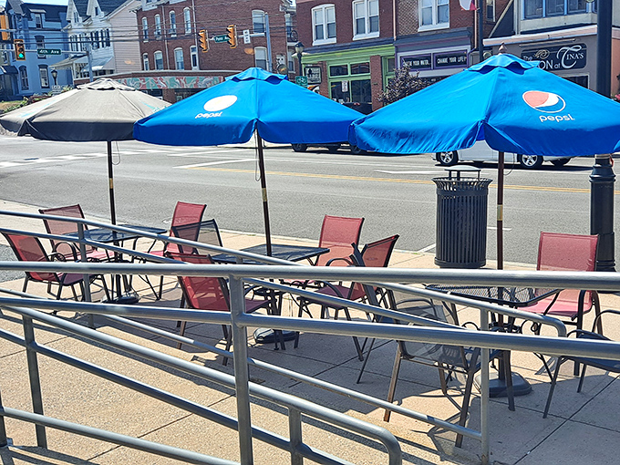 Outdoor seating where you can people-watch along Penn Avenue while debating whether to order dessert (the answer is always yes).