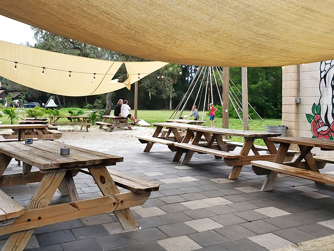 Picnic tables under a Florida sky&mdash;because sometimes the best garnish for fresh seafood is a gentle Gulf breeze.