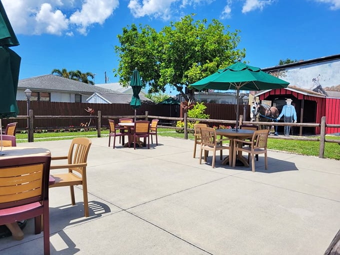 The outdoor seating area&mdash;where you can digest both pie and life decisions under Florida skies. Strategic umbrella placement is an art form.