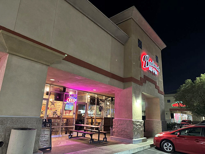 Evening light bathes the entrance in a pink glow, as if the building itself is blushing with pride.