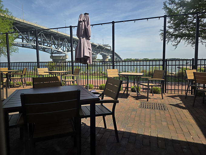 Outdoor seating with a bridge view—where your table reservation comes with complimentary vitamin D and river breezes.