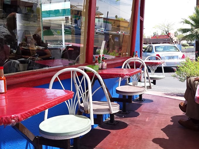 Outdoor seating with a splash of color. These tables have hosted more meaningful conversations than most therapists' offices.