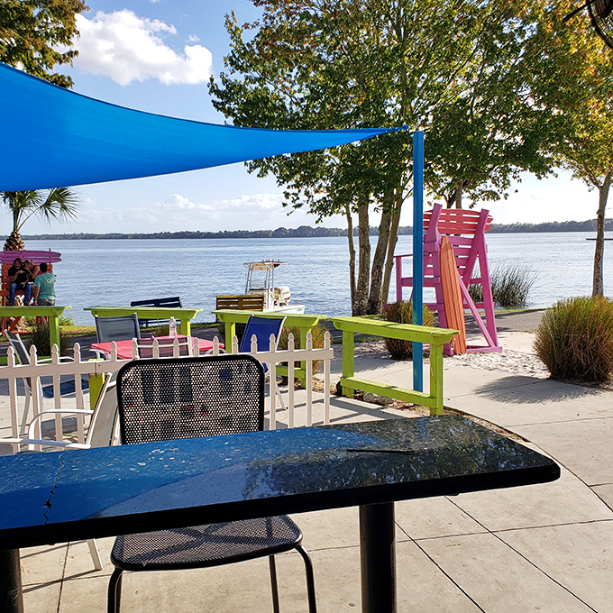 Cheerful colors and waterfront views combine to create the ultimate "why would anyone eat indoors?" experience.
