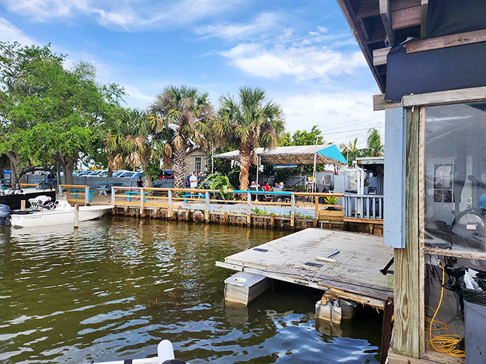 Waterfront dining where the palm trees and dock create that "yes, you're really in Florida" moment tourists dream about.