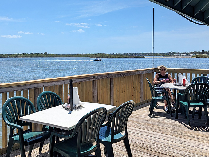 Social distancing, Florida-style. Tables spaced for optimal viewing of passing boats and the occasional dolphin making a guest appearance.