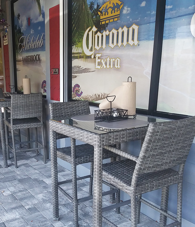 Outdoor seating with Corona vibes. These wicker chairs and glass tables offer the perfect perch for enjoying seafood with a side of Florida sunshine.