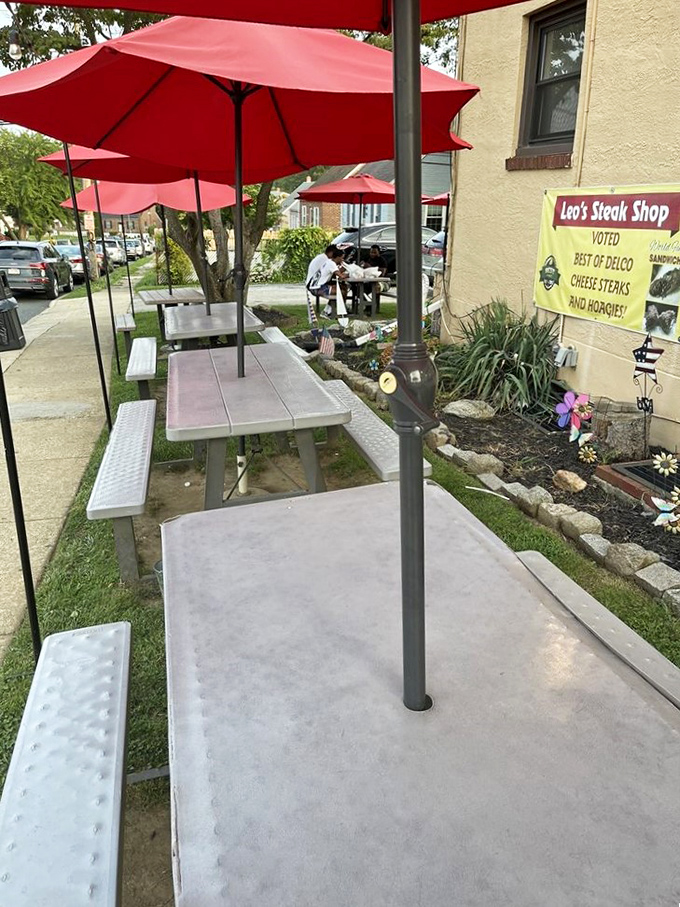 Red umbrellas shade the outdoor seating area—a relatively new luxury for a place where most orders have traditionally been "to go."