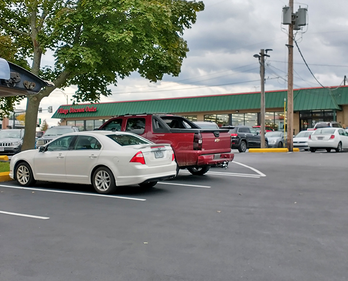 The parking lot fills up as word spreads about today's deals. Even from outside, you can feel the magnetic pull of bargains.