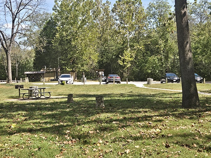 The welcoming parking area offers easy access to this hidden gem, with plenty of shade for hot summer days.